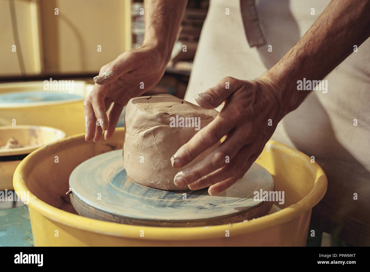 Creating a jar or vase of white clay close-up. Master crock Stock Photo ...