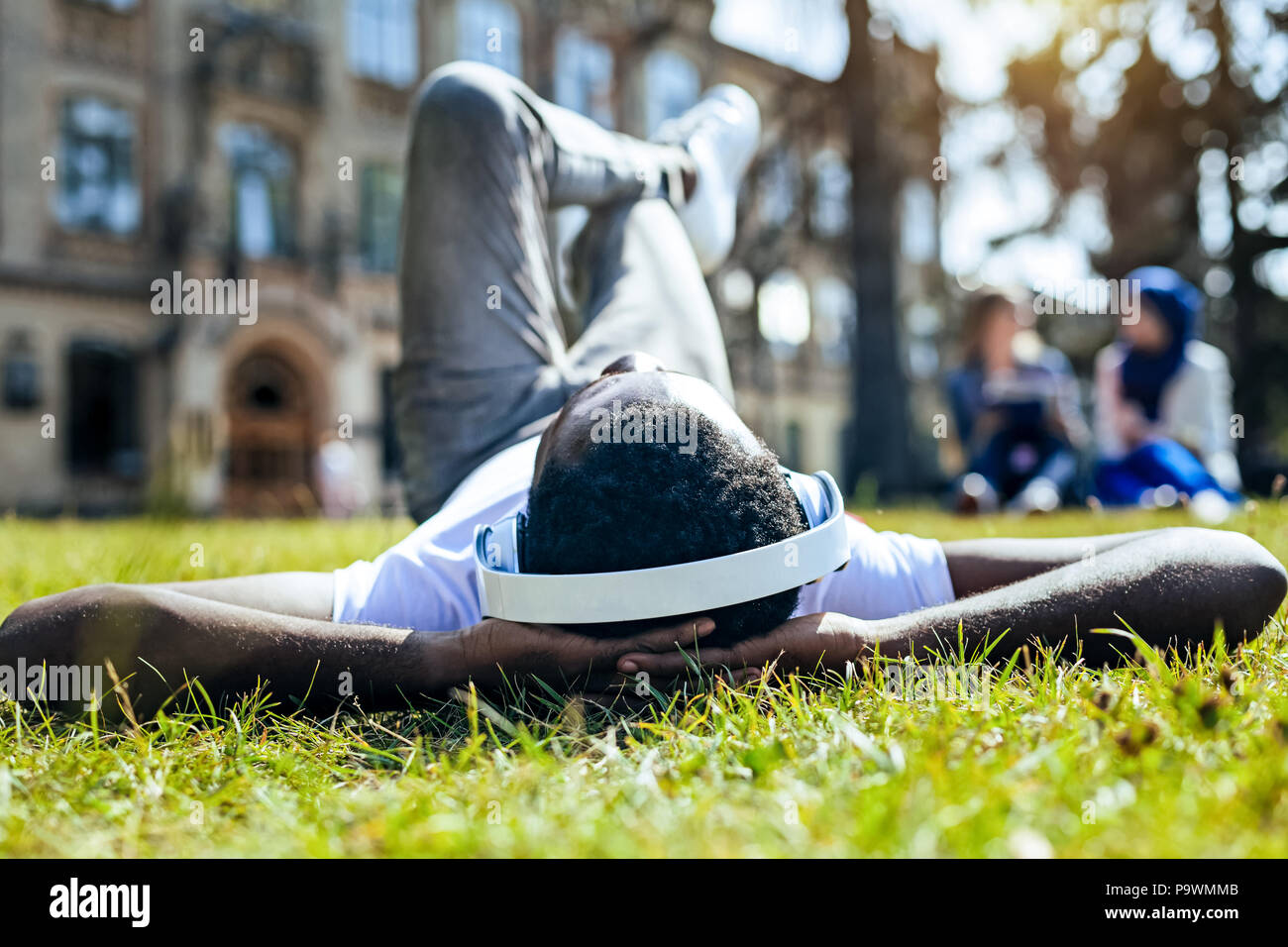 Relaxed african american student listening hi-res stock photography and ...