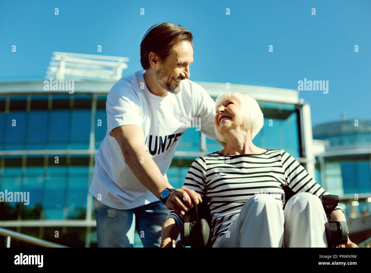 Positive delighted people walking in the yard Stock Photo - Alamy