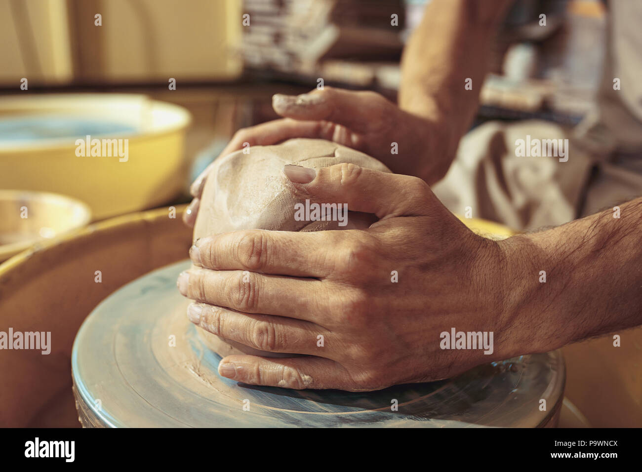 Creating a jar or vase of white clay close-up. Master crock Stock Photo ...