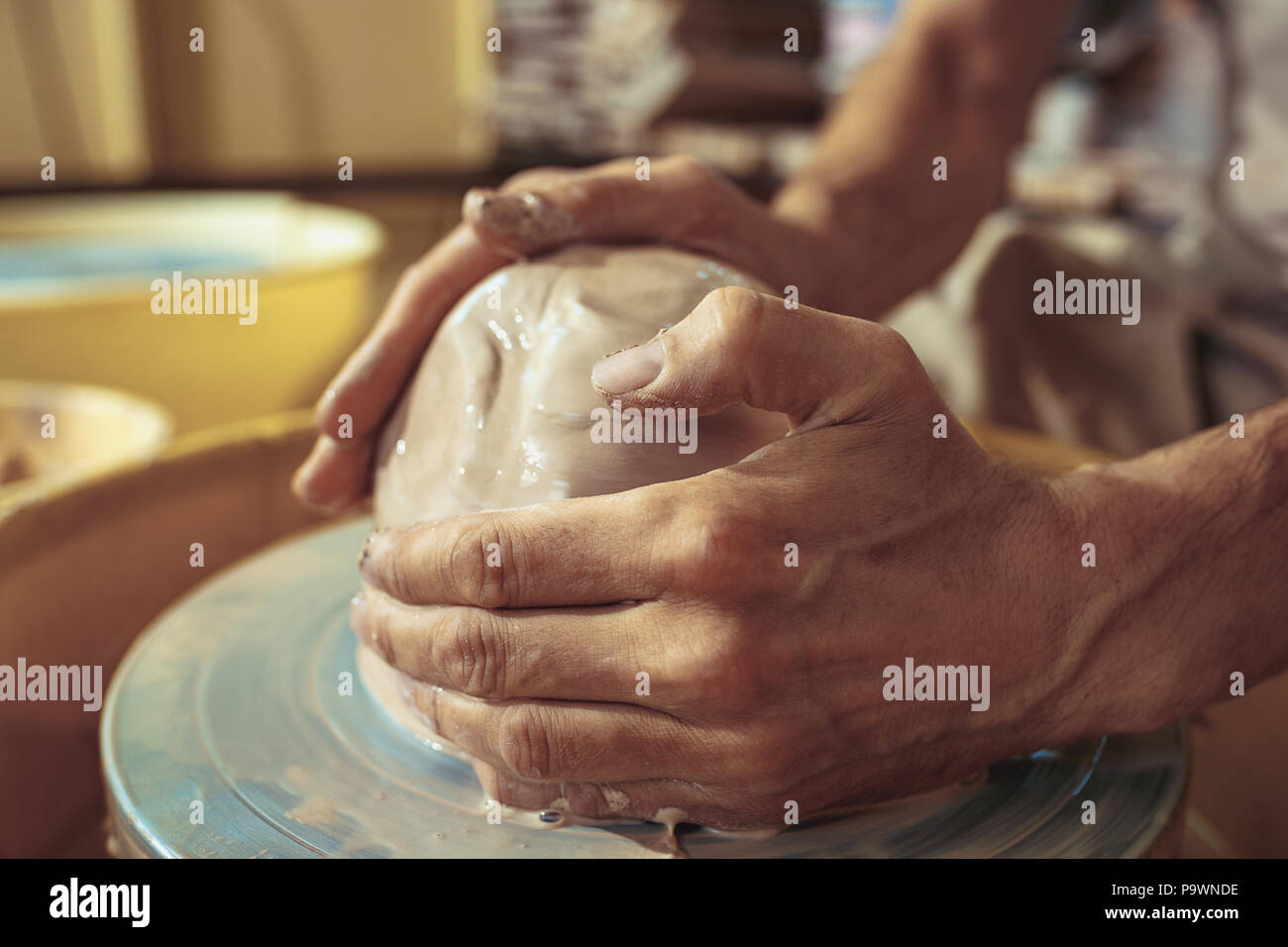 Creating a jar or vase of white clay close-up. Master crock Stock Photo ...