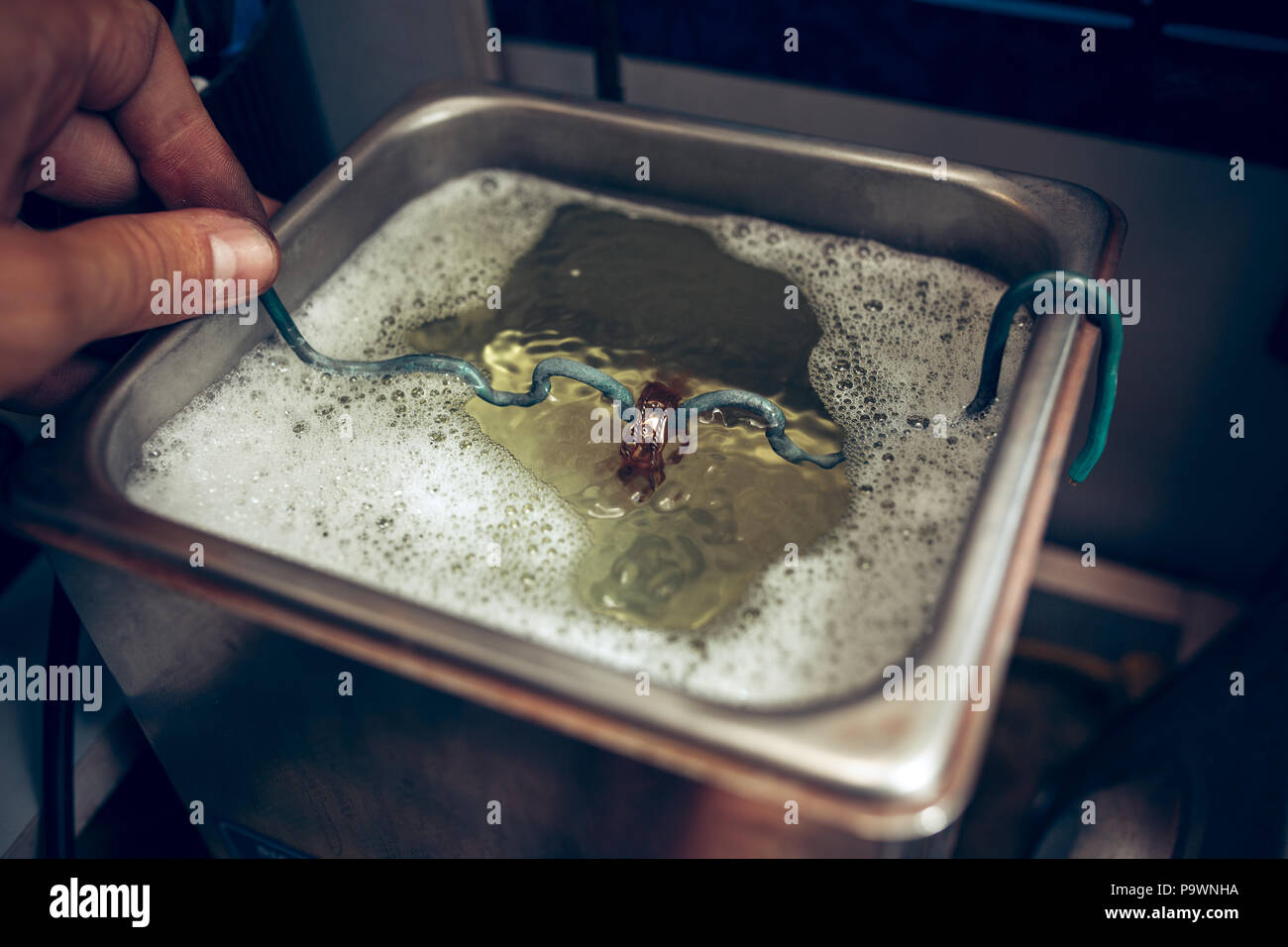 Different goldsmiths tools on the jewelry workplace. Jeweler at work in ...