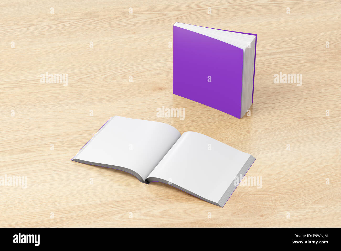 Blank violet square soft cover books open and standing on wooden ...