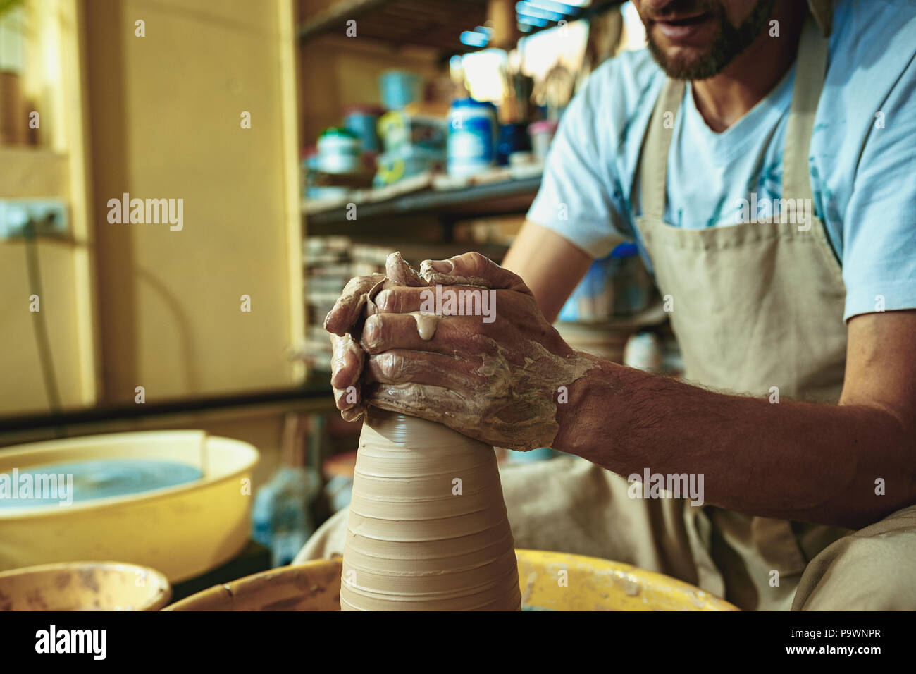 Creating a jar or vase of white clay close-up. Master crock Stock Photo ...