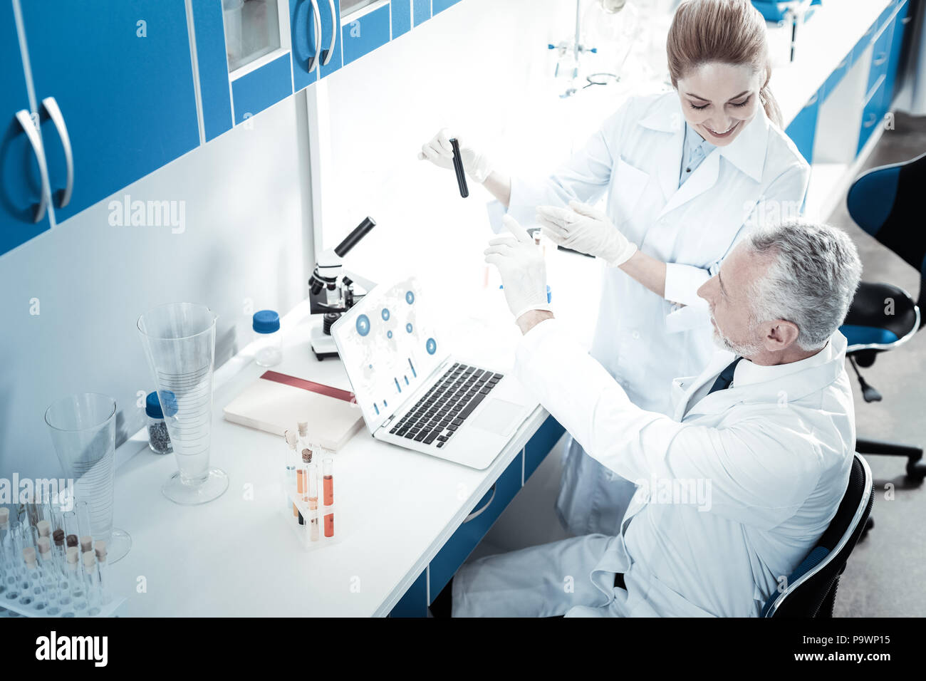 Nice professional scientist discussing their work Stock Photo - Alamy