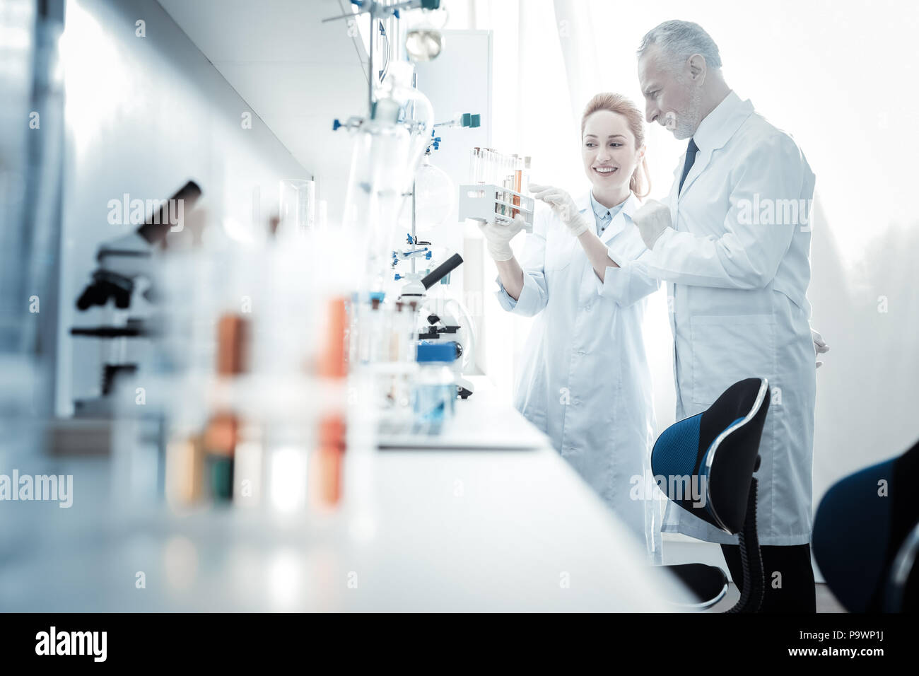Professional positive scientists standing together Stock Photo - Alamy Professional positive scientists standing together Stock Photo - Alamy