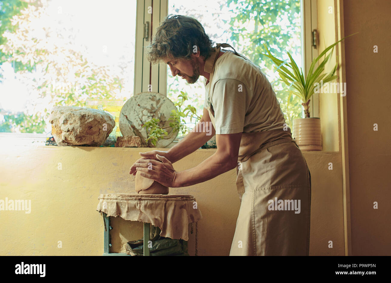 Creating a jar or vase of white clay close-up. Master crock Stock Photo ...
