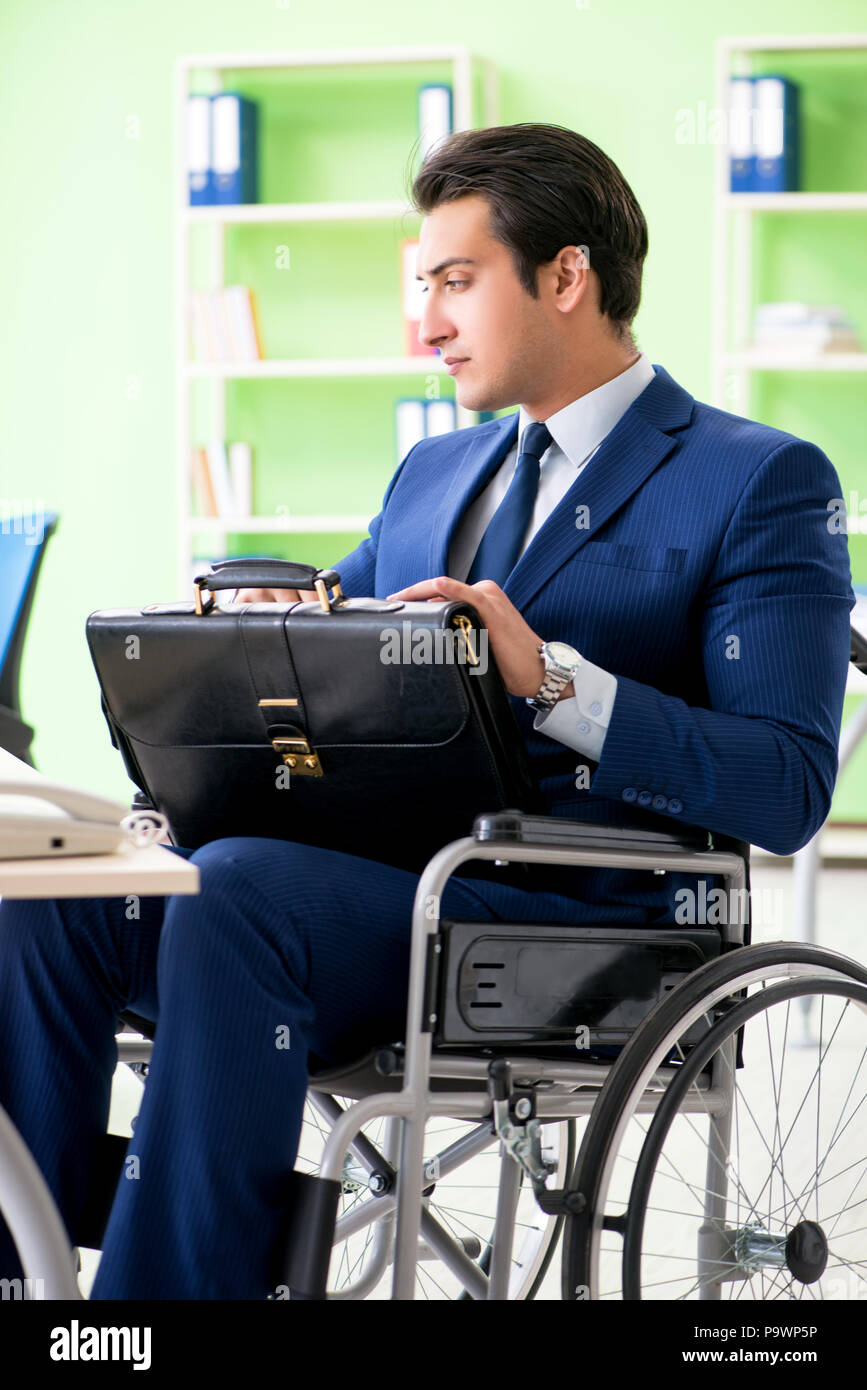 Disabled businessman working in the office Stock Photo - Alamy