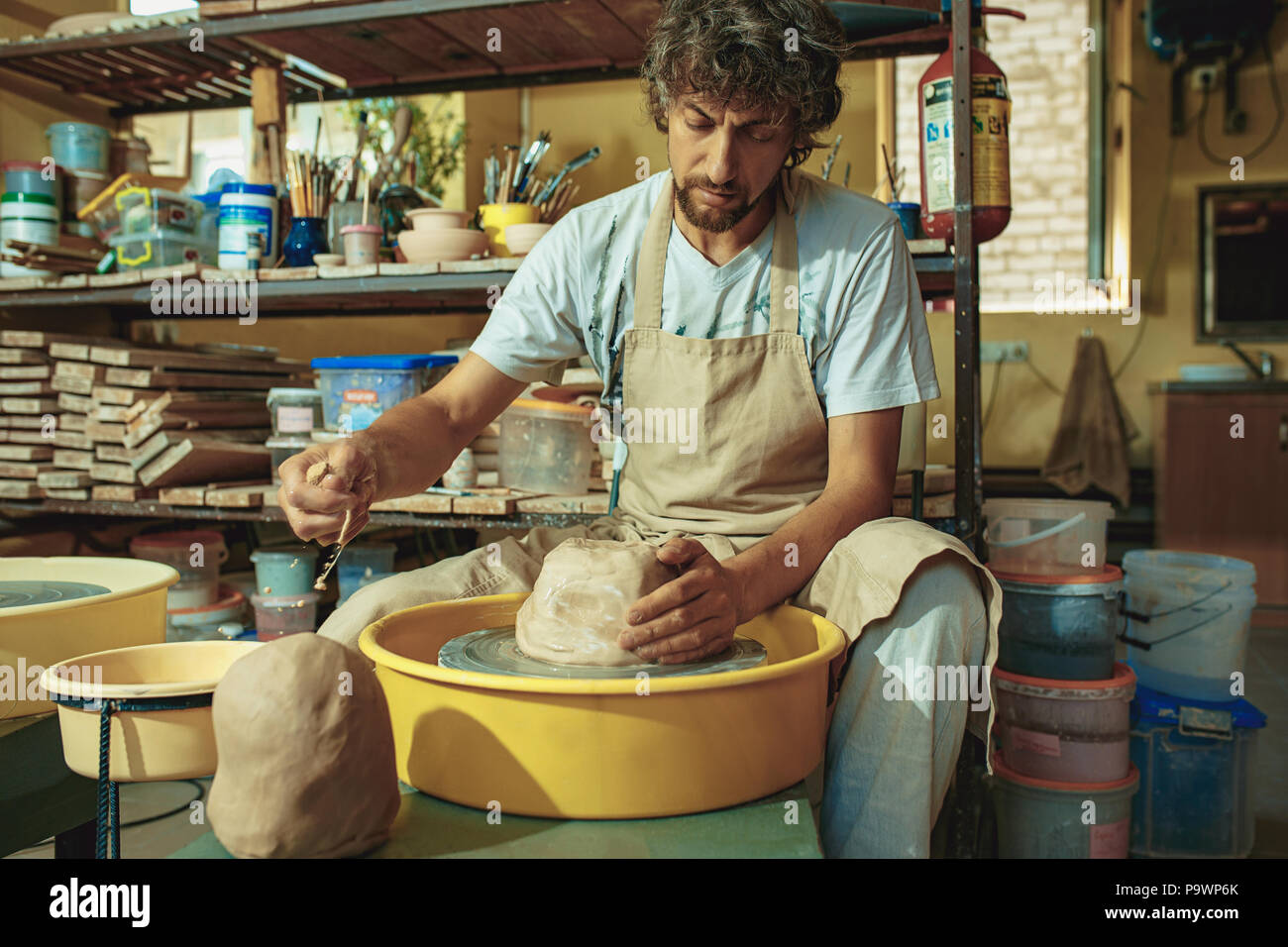 Creating a jar or vase of white clay close-up. Master crock Stock Photo ...