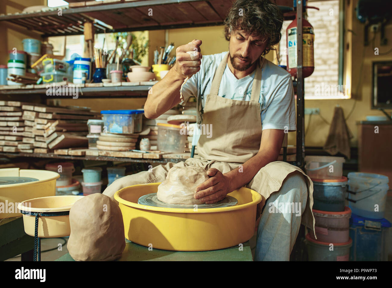 Creating a jar or vase of white clay close-up. Master crock Stock Photo ...