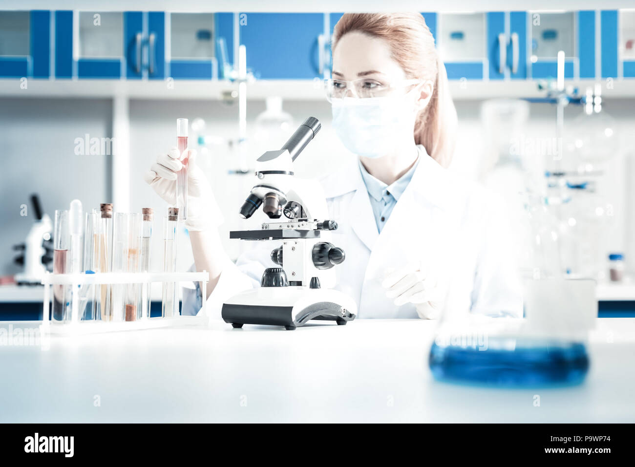 Smart experienced biologist doing an analysis Stock Photo - Alamy
