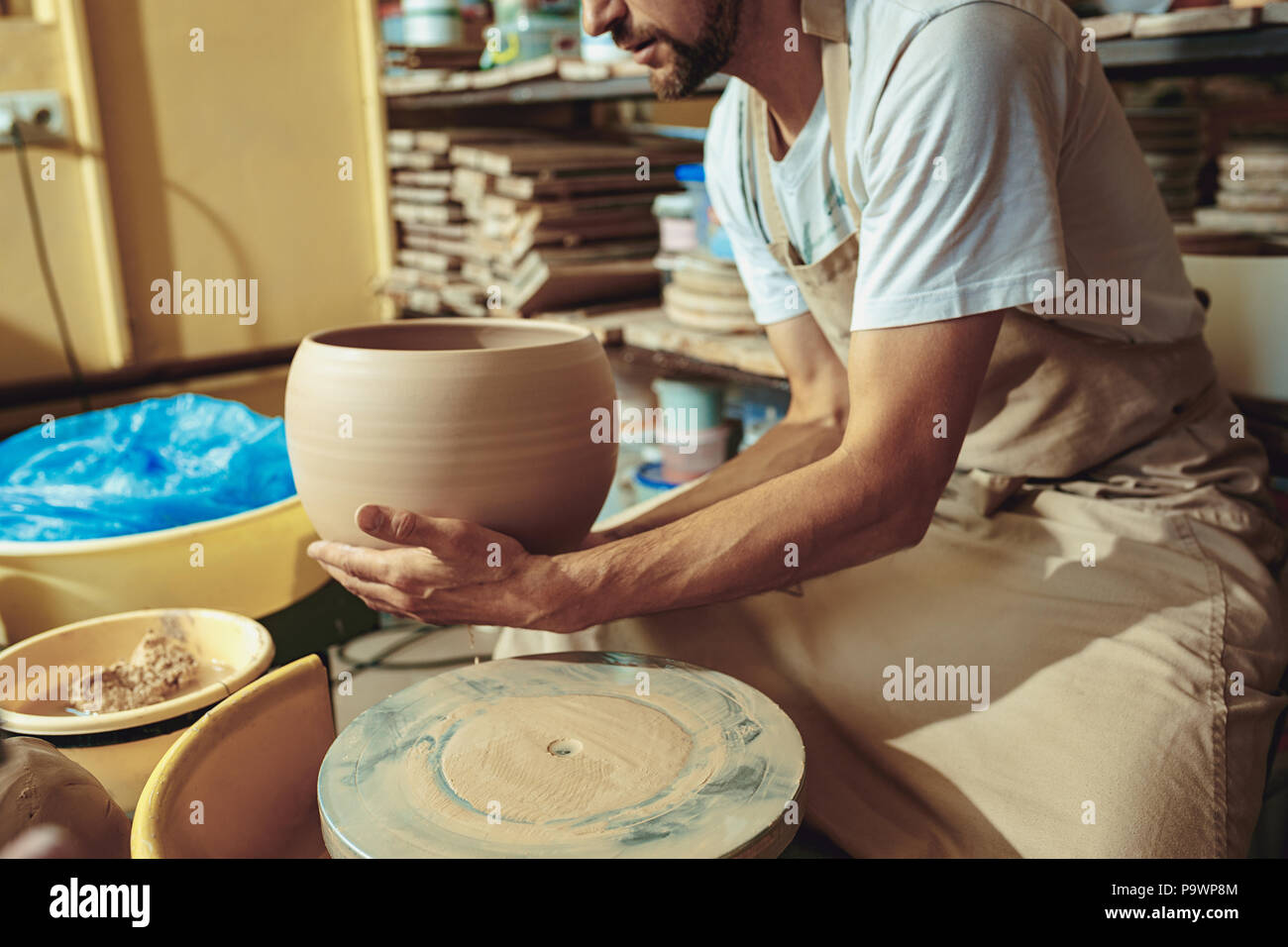 Creating a jar or vase of white clay close-up. Master crock Stock Photo ...