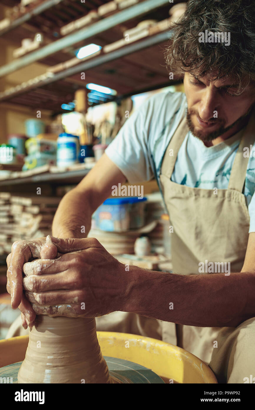 Creating a jar or vase of white clay close-up. Master crock Stock Photo ...