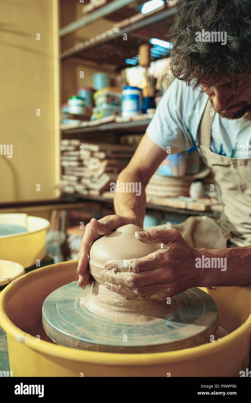 Creating a jar or vase of white clay close-up. Master crock Stock Photo ...