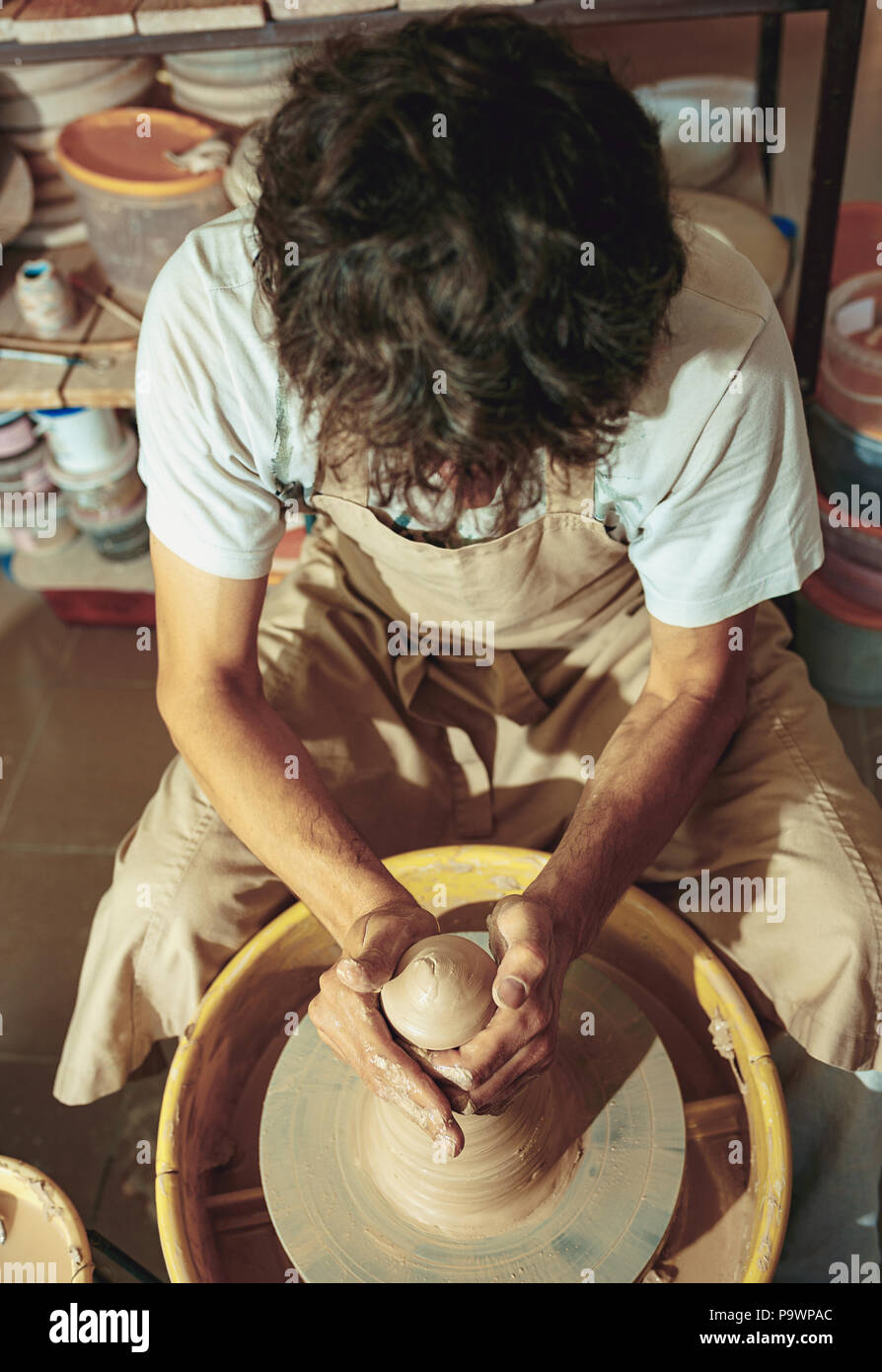 Creating a jar or vase of white clay close-up. Master crock Stock Photo ...