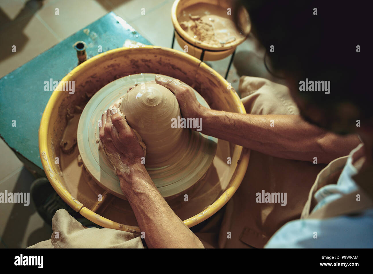 Creating a jar or vase of white clay close-up. Master crock Stock Photo ...