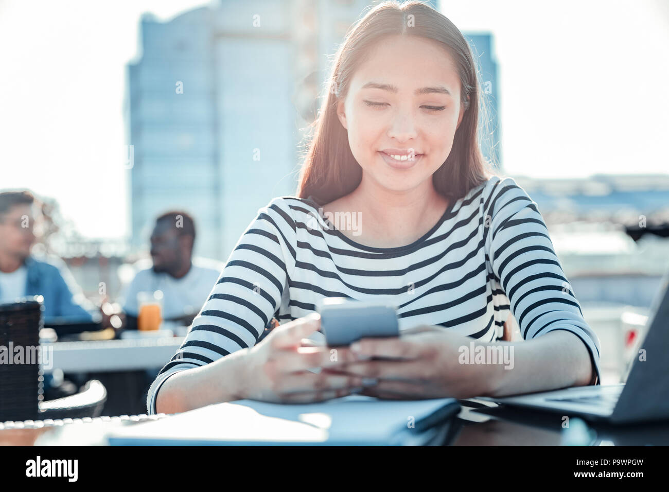 Portrait of charming international female that typing message Stock ...