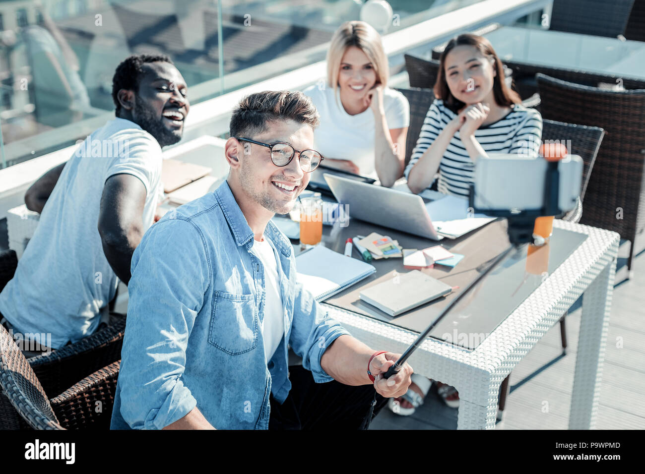Happy group mates posing on camera Stock Photo - Alamy