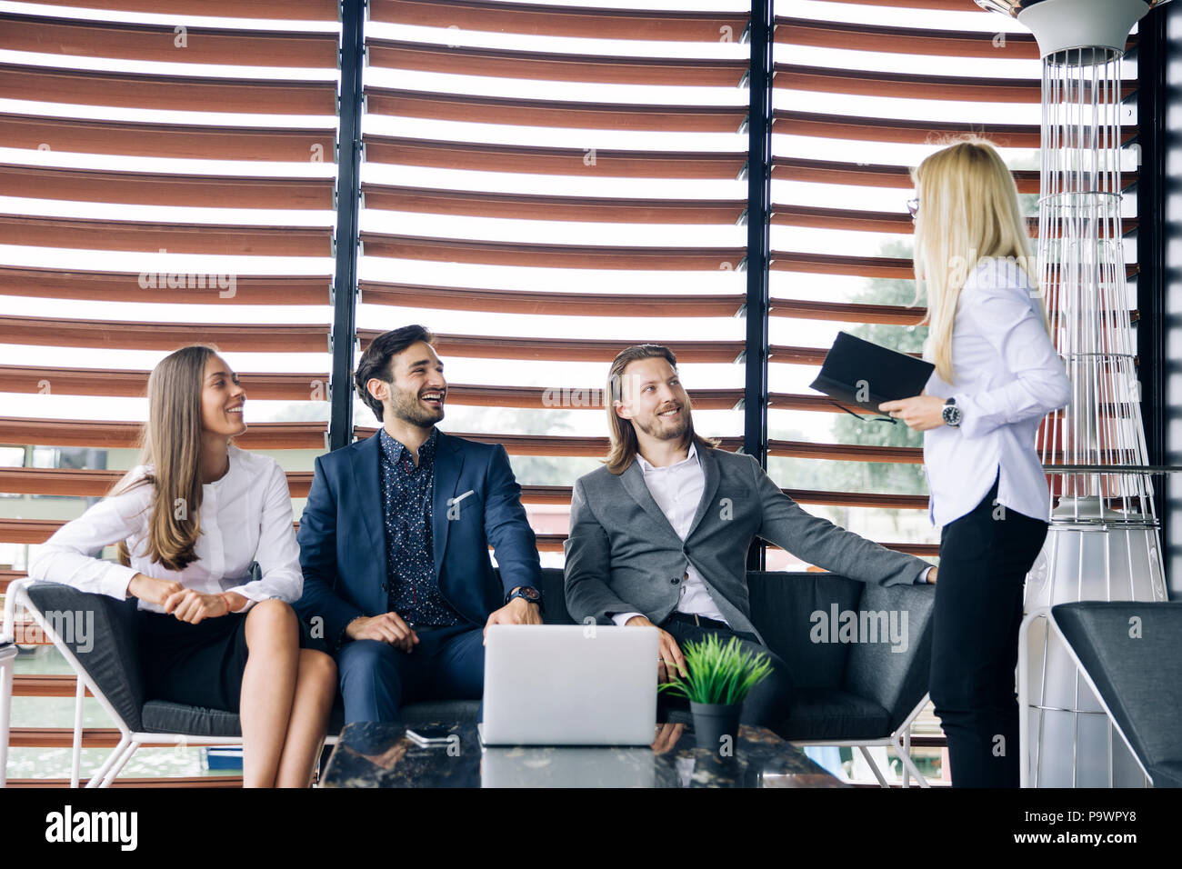 Young people group in modern office have team meeting and brainstorming ...