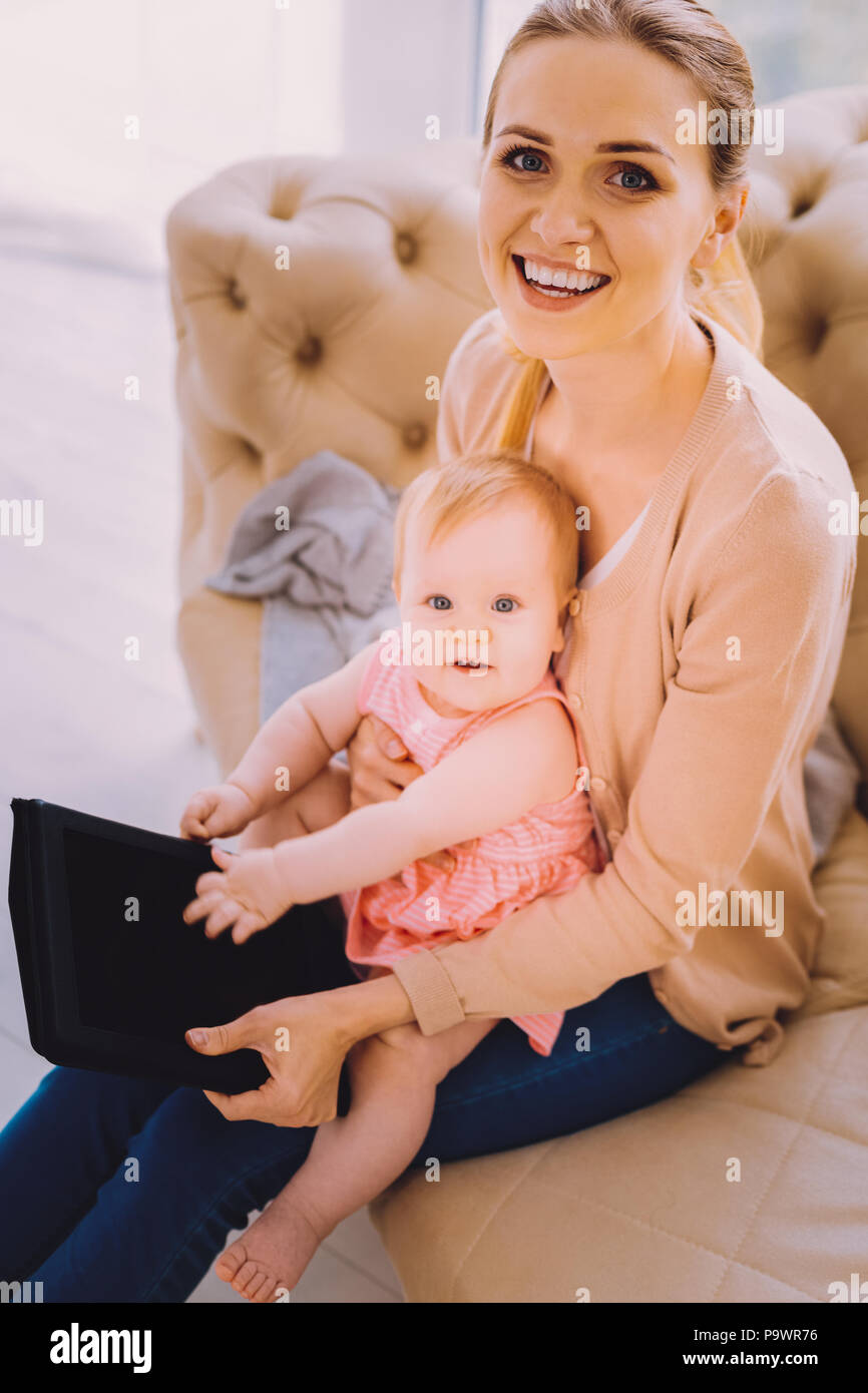 Good friends. Qualified experienced babysitter feeling happy while ...