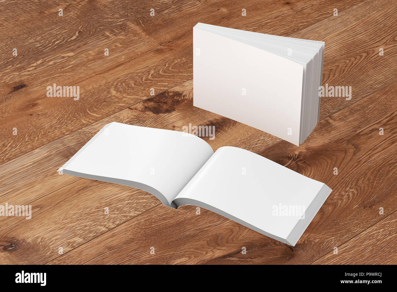 Blank white horizontal soft cover books open and standing on wooden ...