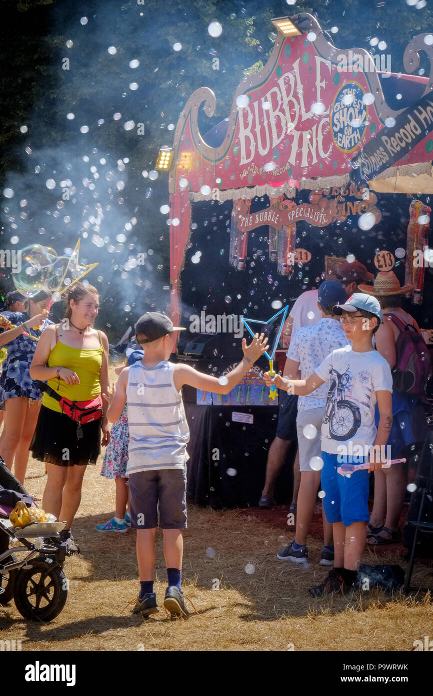 Boys making and chasing bubbles at the Bubble Inc stall with bubbles ...