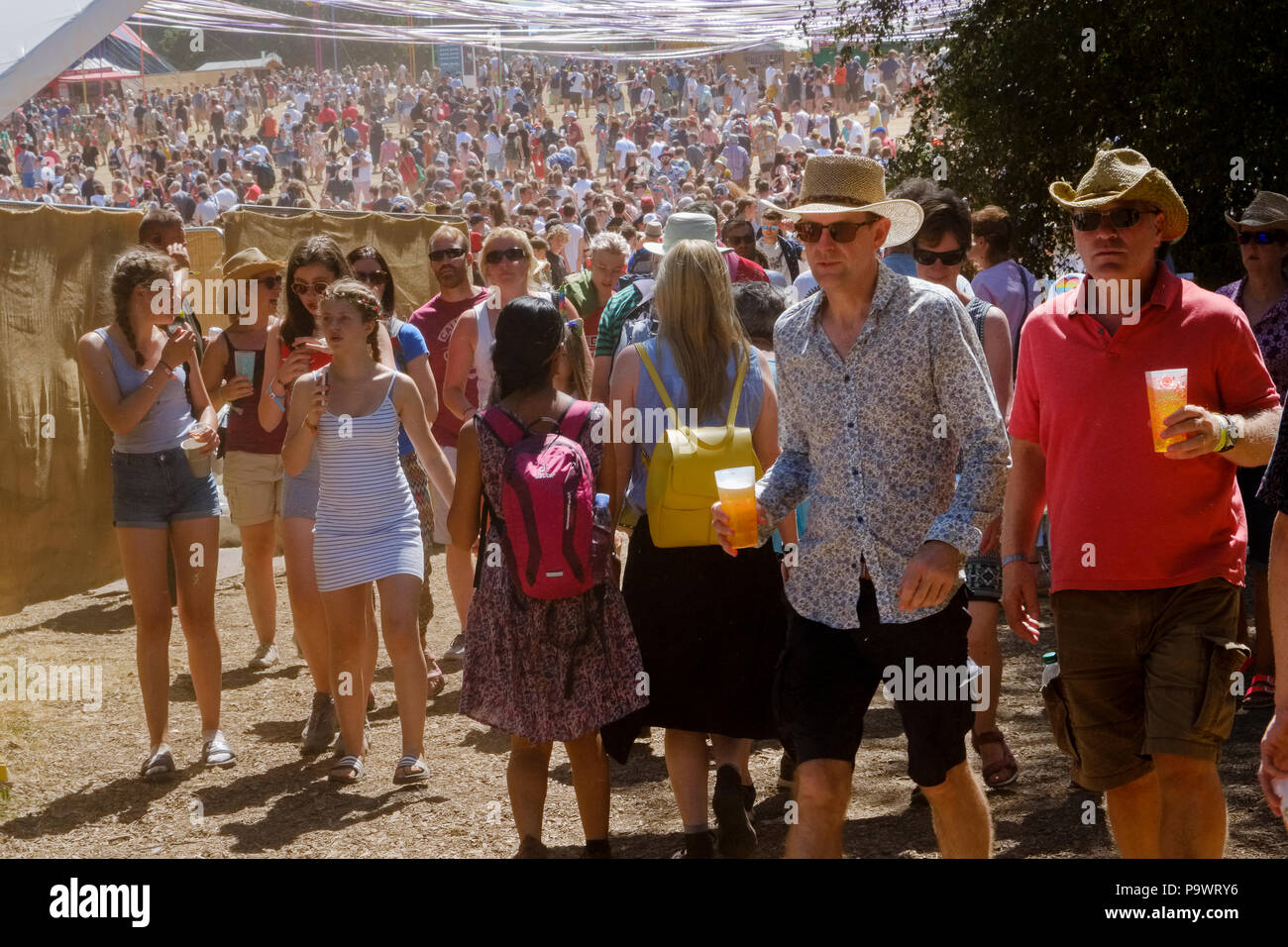 Girls with phones, girls with drinks, girls with coloured backpacks ...