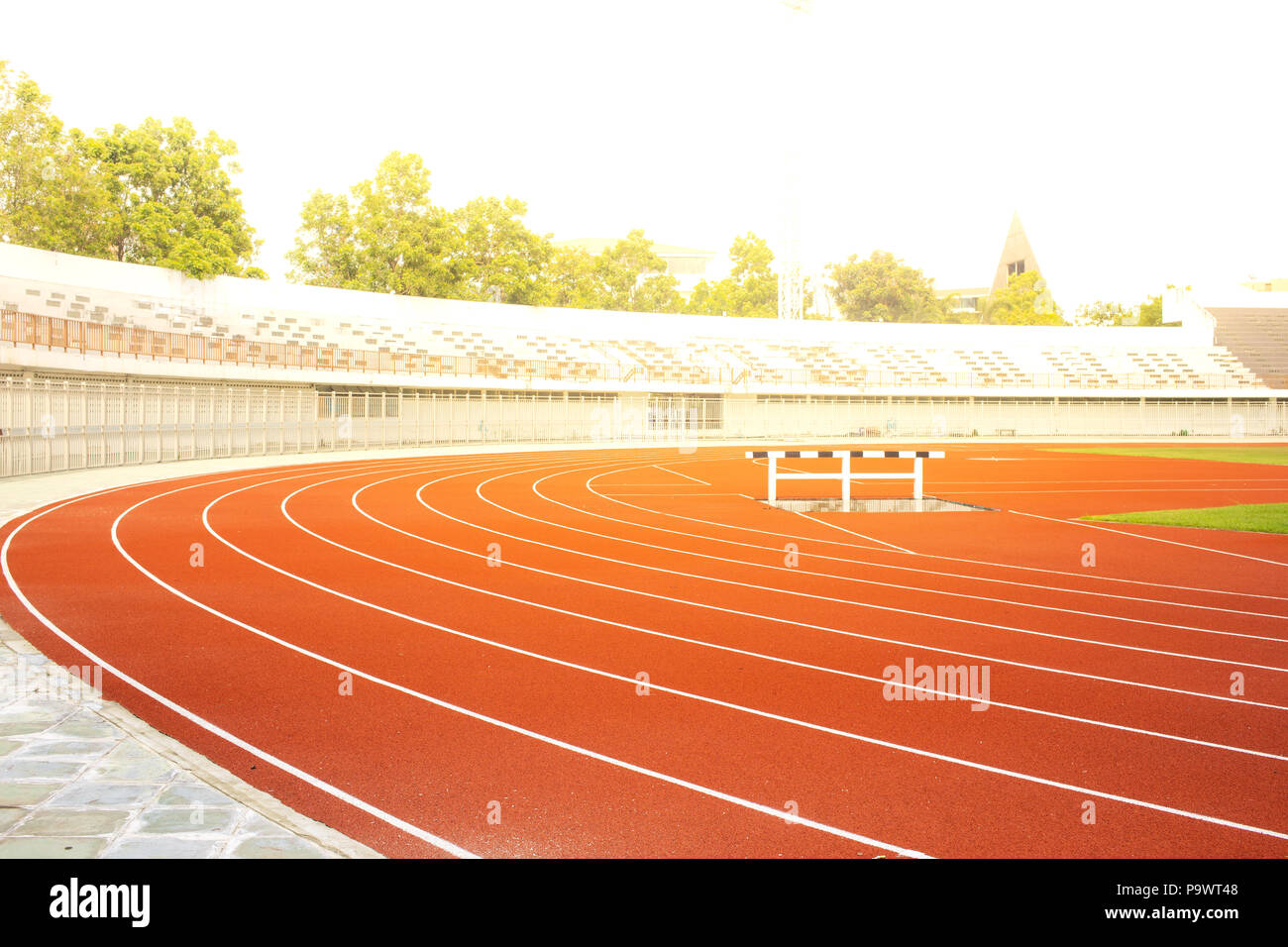 The Red Running Track in the stadium Stock Photo - Alamy