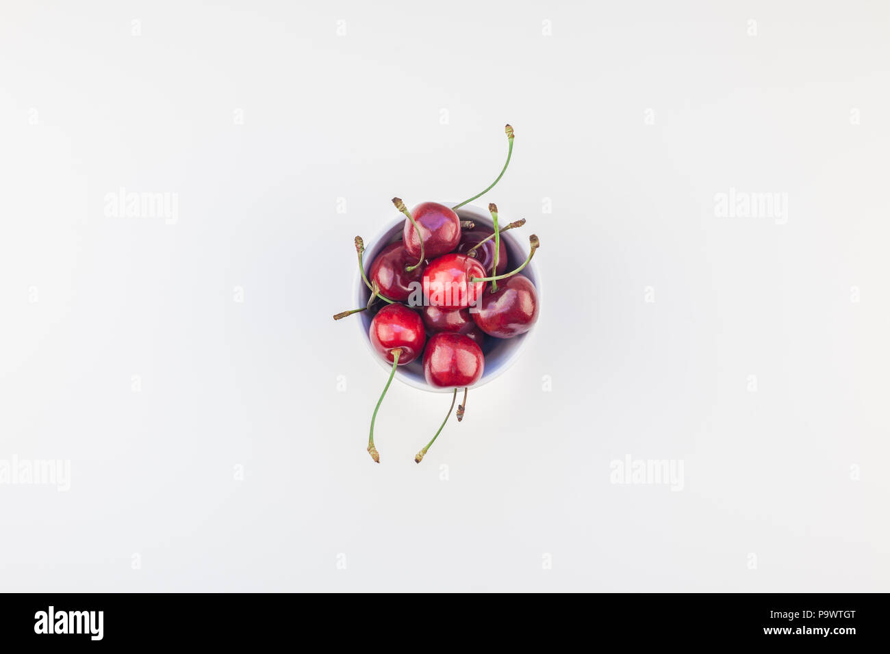 Creative top view of fresh ripe cherry in a bowl with copy space ...