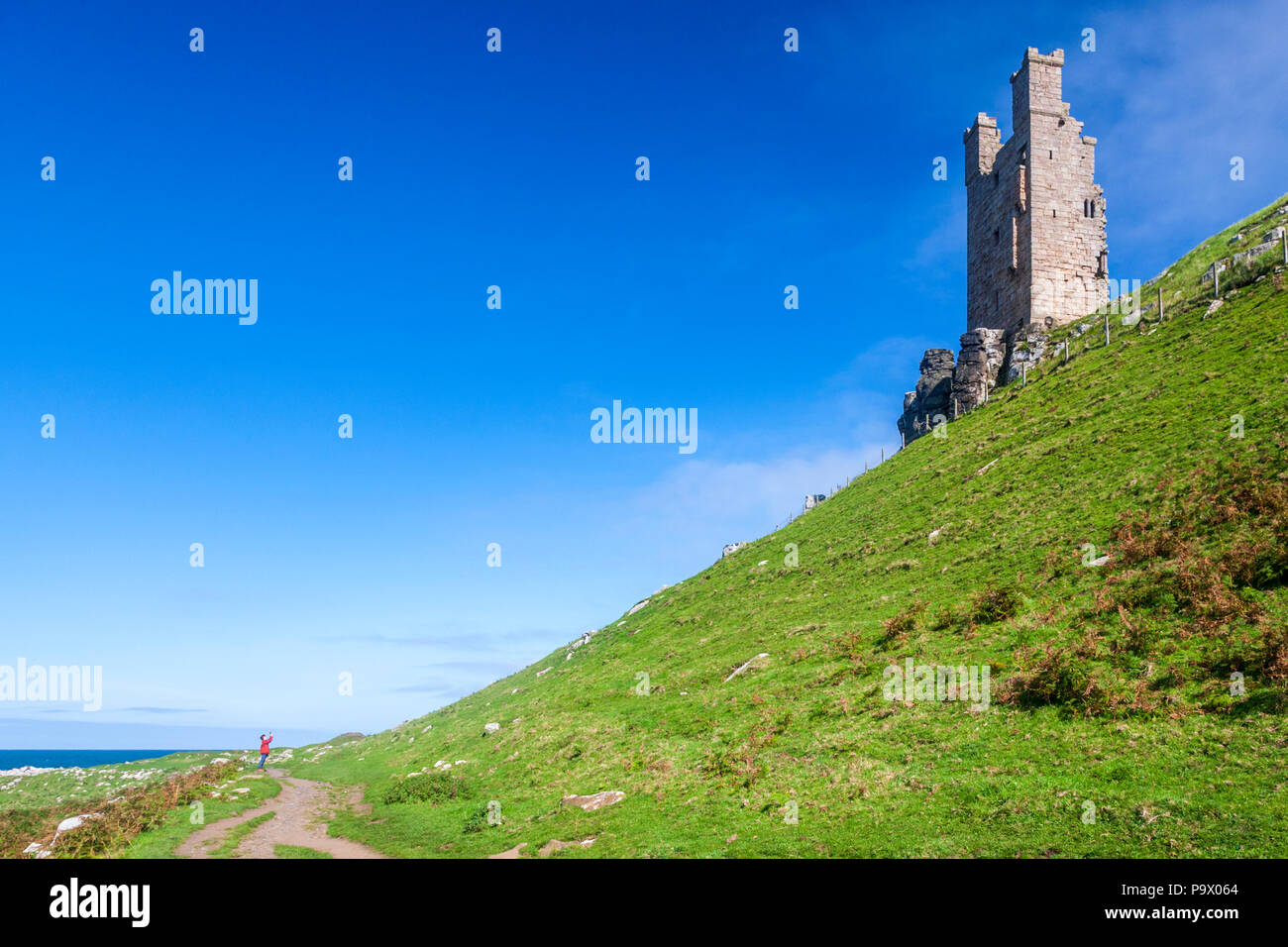 The ruins of the 14th century Dunstanburgh Castle on the Northumberland ...