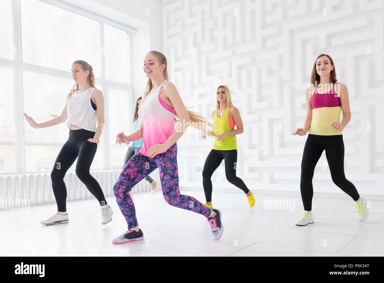Group of happy young women having a fitness dance class Stock Photo - Alamy