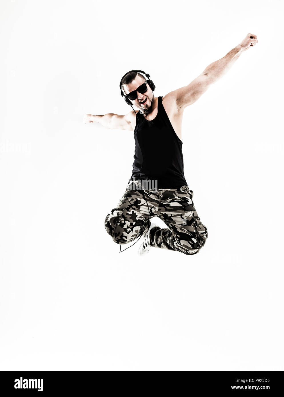 emotional and charismatic DJ - rapper with headphones on a white Stock ...