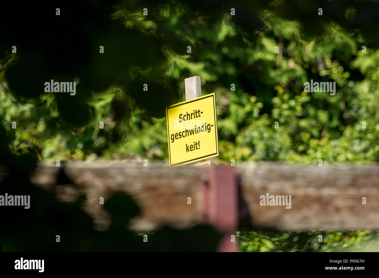 A warning sign that reads: walking speed Stock Photo - Alamy