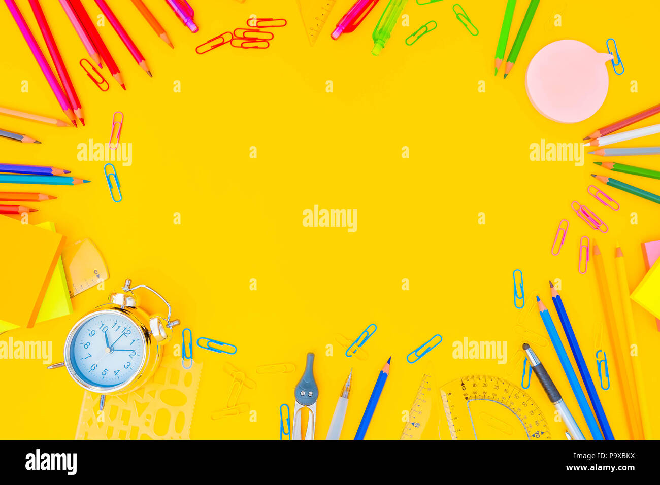 back to school styed frame s with muilticolored school supplies on ...