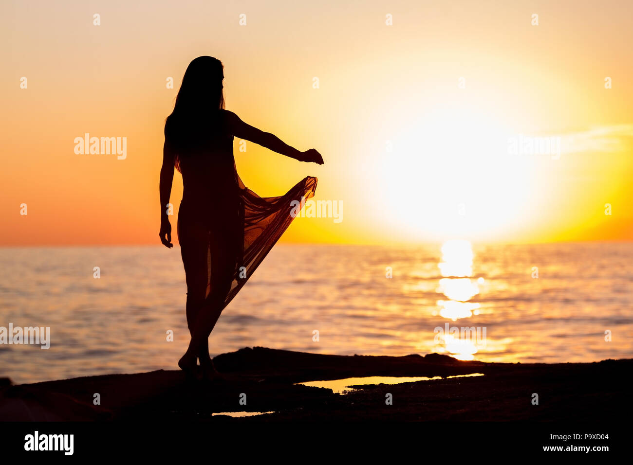 Woman Sunbathing Beach Silhouette High Resolution Stock Photography and ...
