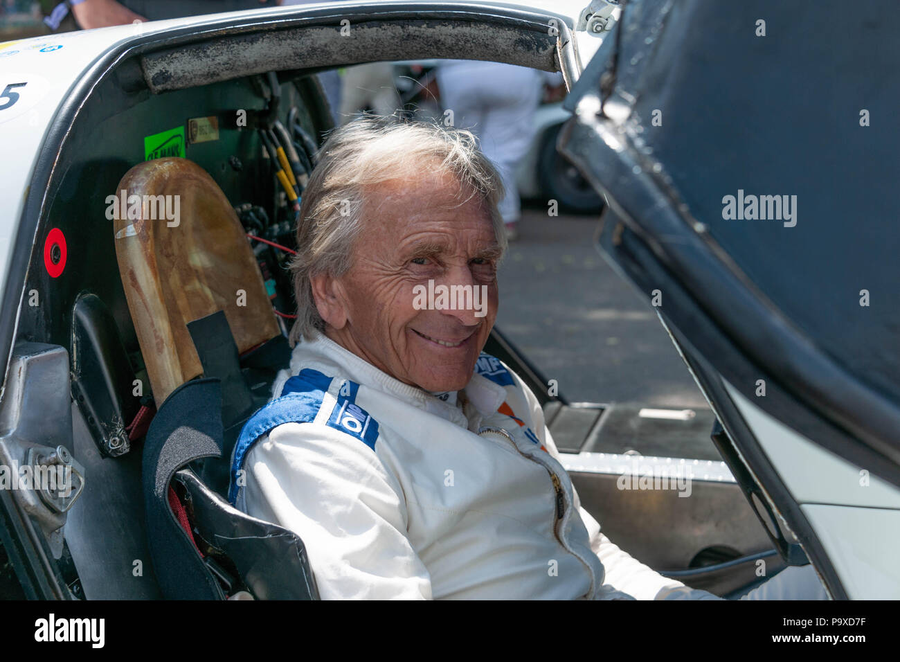 Derek Bell sitting in one of his cars at Goodwood Festival of Speed ...