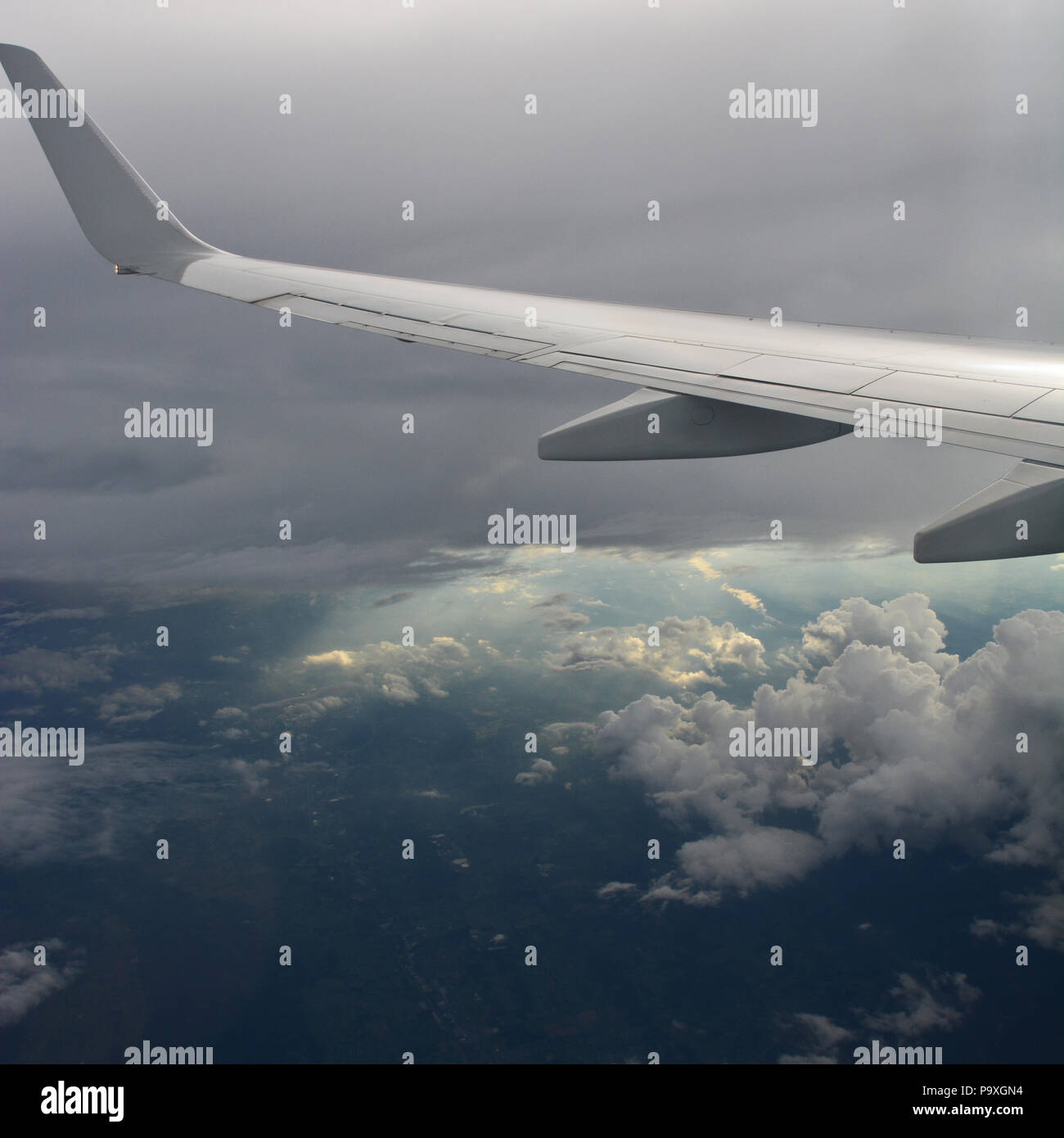 The view from a passenger jet flying high over storm clouds in the ...