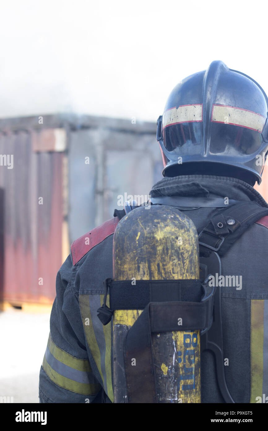 Firefighter putting out fire training station extinguisher backdraft ...