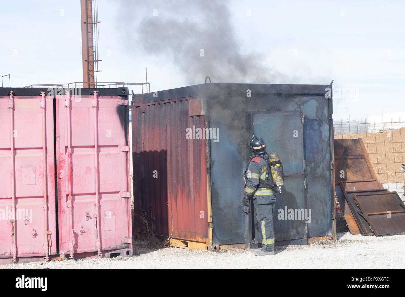 Firefighter putting out fire training station extinguisher backdraft ...