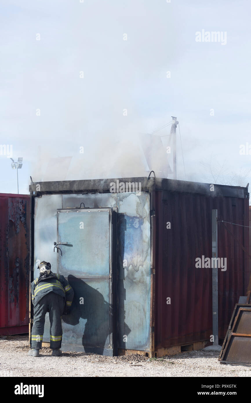 Firefighter putting out fire training station extinguisher backdraft ...