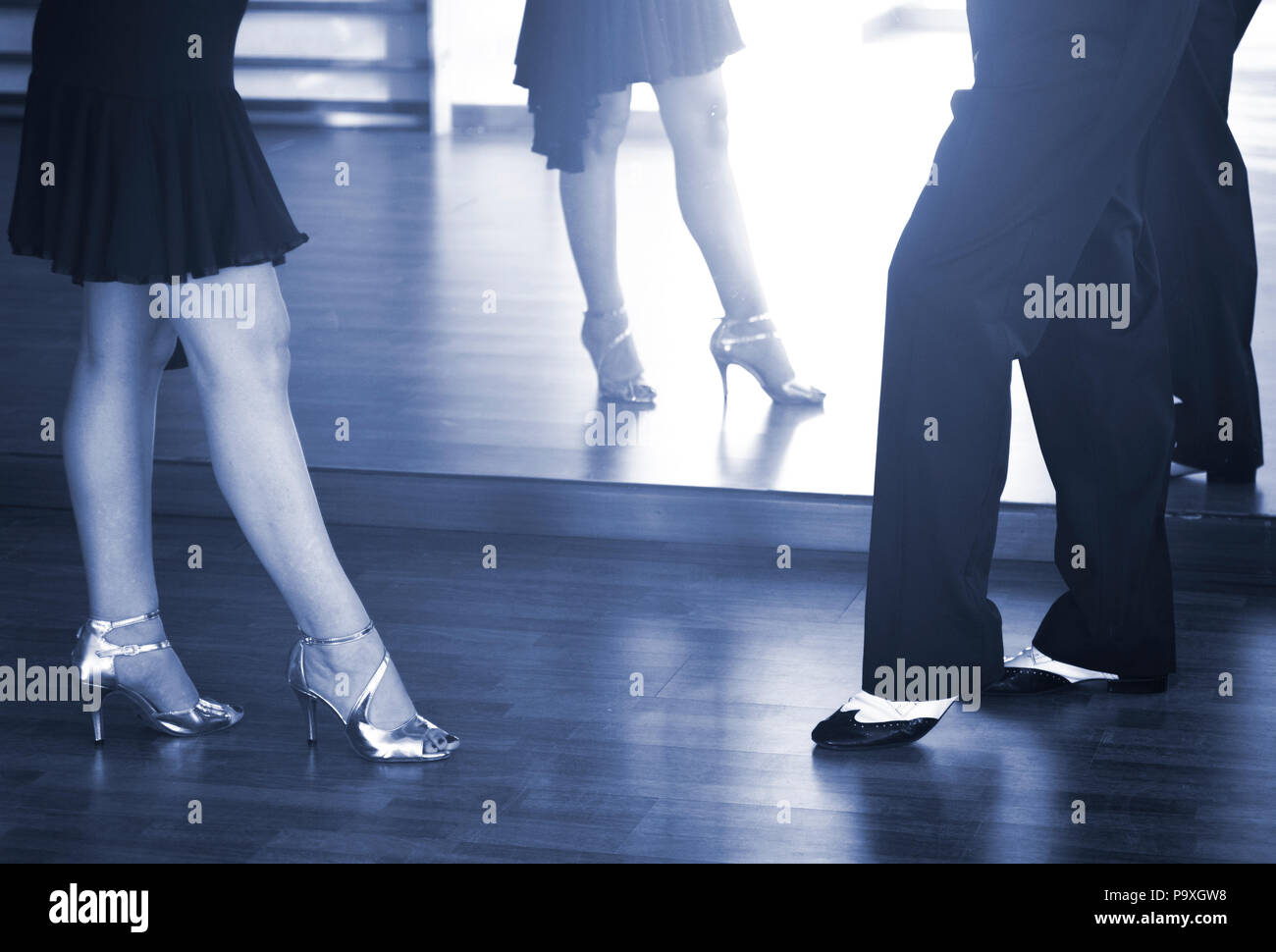 Ballroom dance couple of dancers and teachers in studio school dancing ...