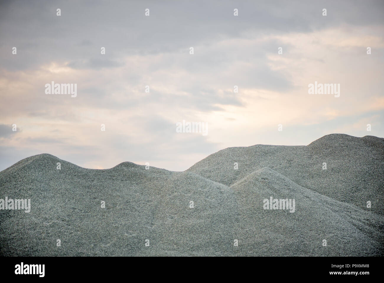 Large piles of construction sand and gravel used for asphalt production ...
