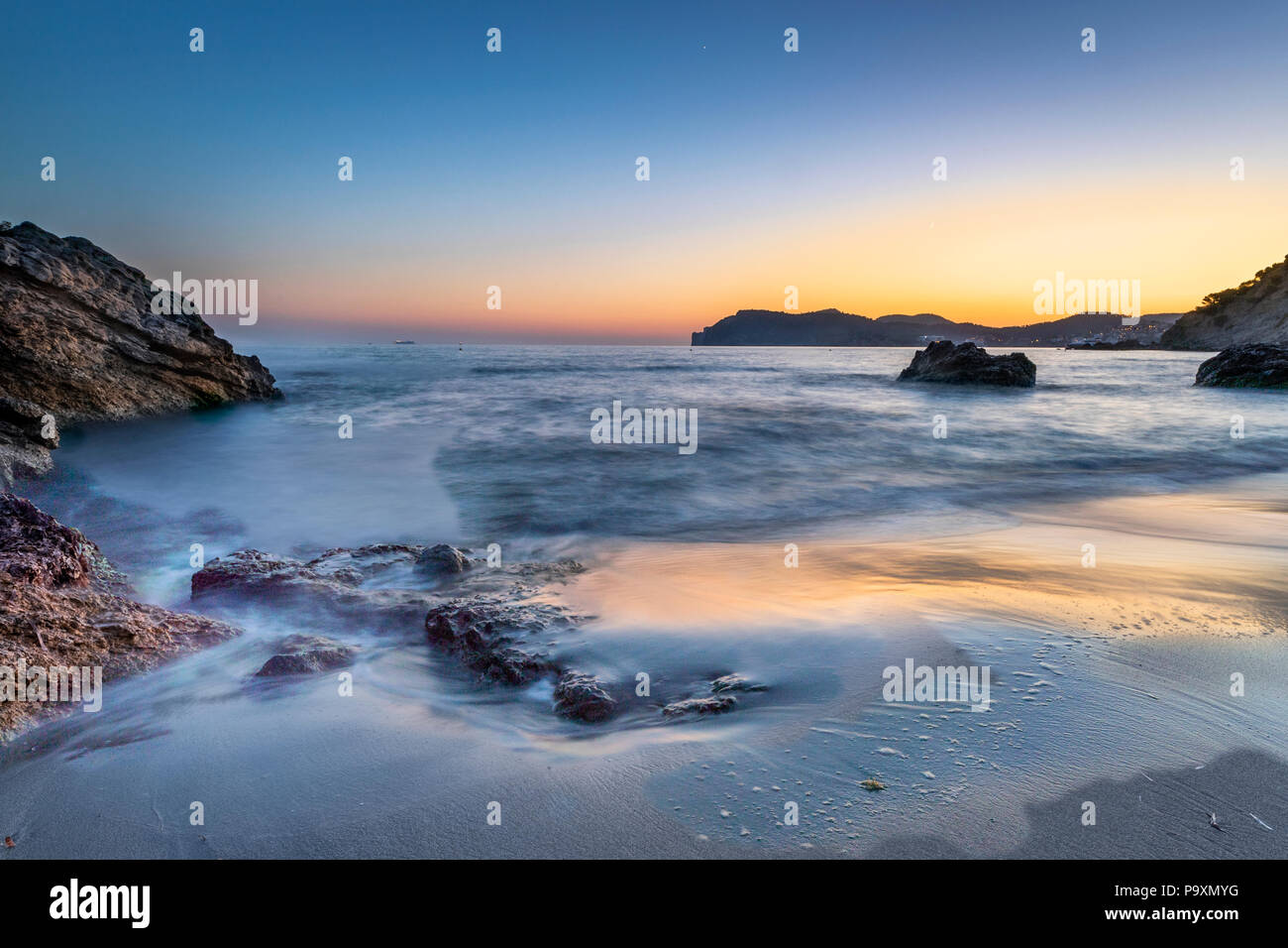 Seascape Mediterranean at sunset, warm color sky, mystic blue light ...