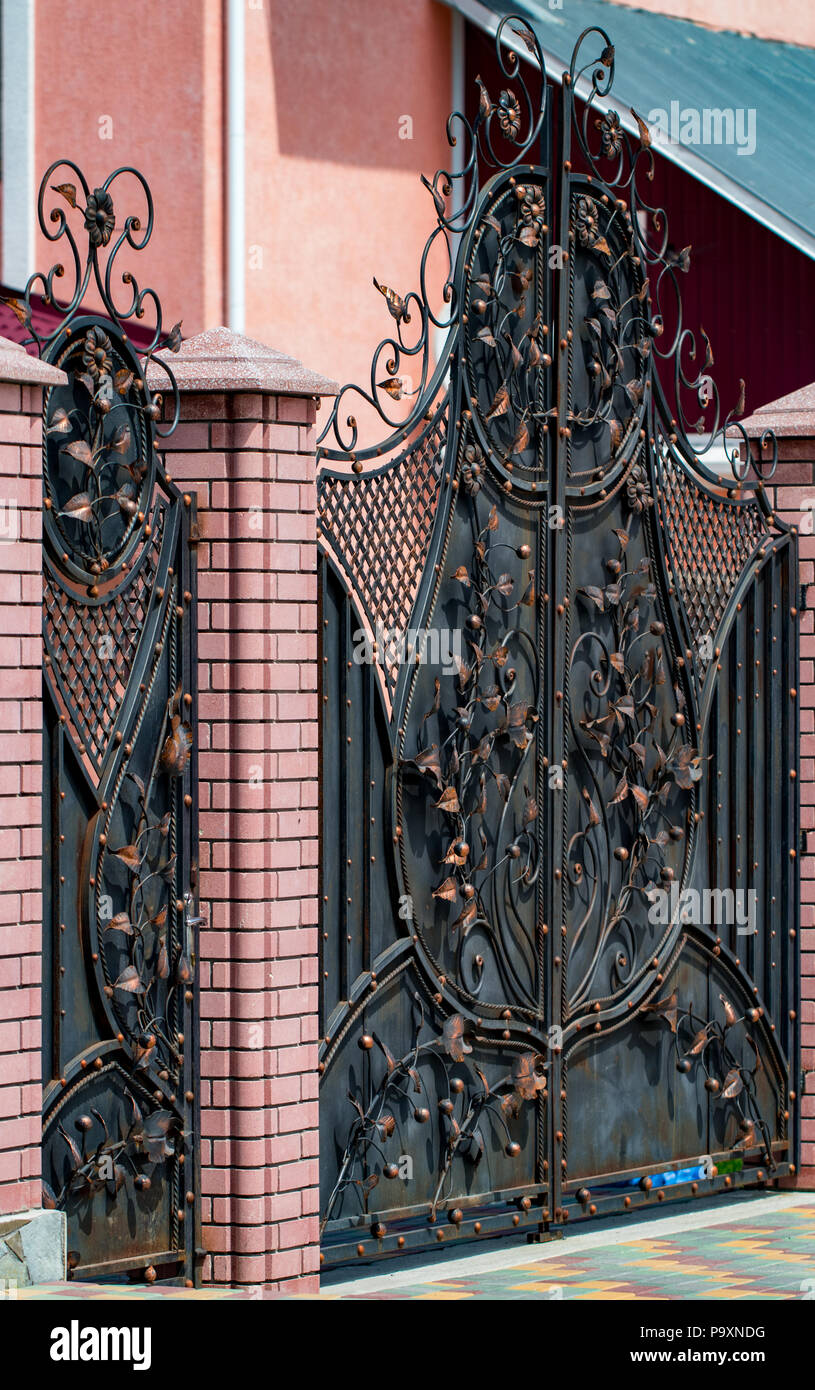 ornate wrought-iron elements of metal gate decoration Stock Photo - Alamy