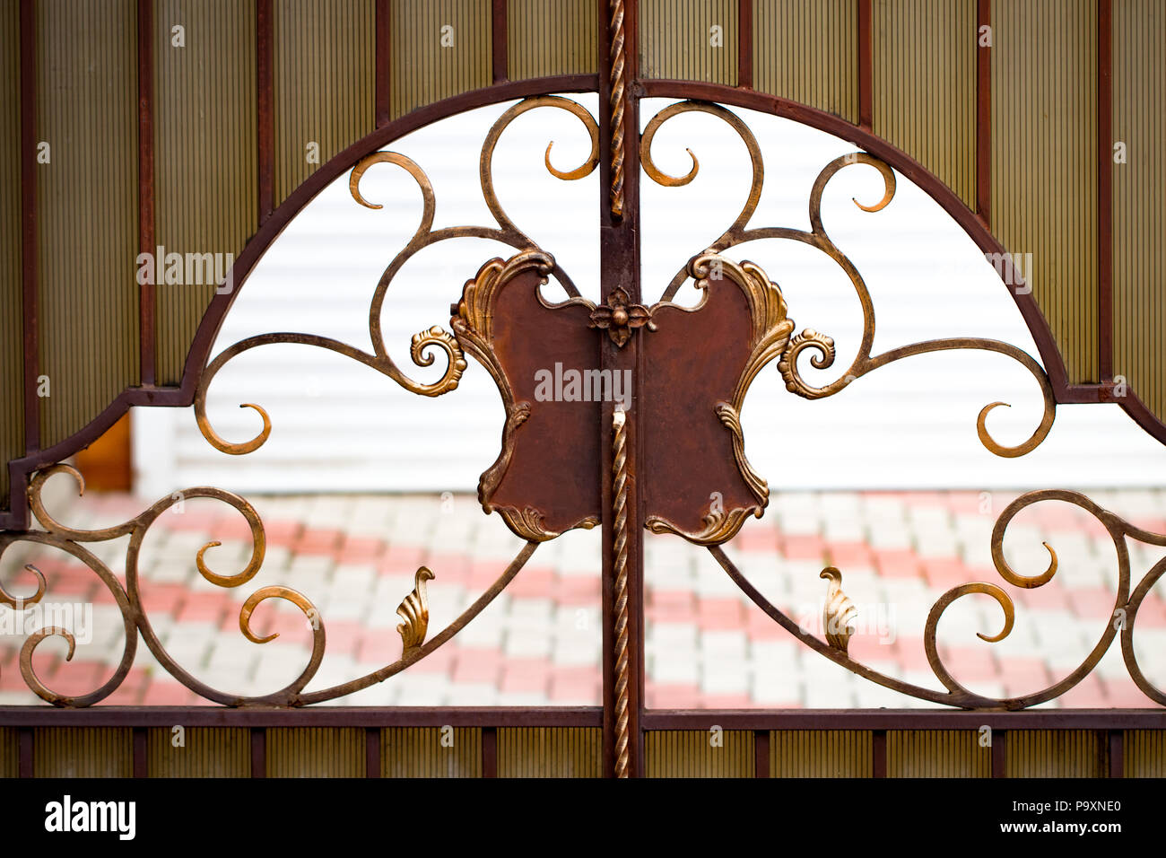 ornate wrought-iron elements of metal gate decoration Stock Photo - Alamy