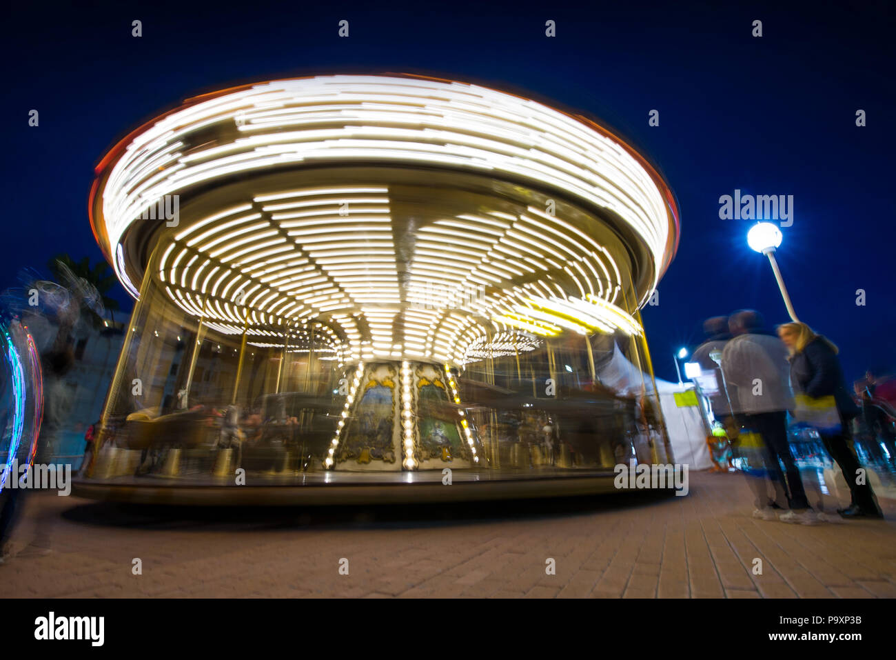 Abstract, long exposure shot of spinning Children's vintage Carousel at ...