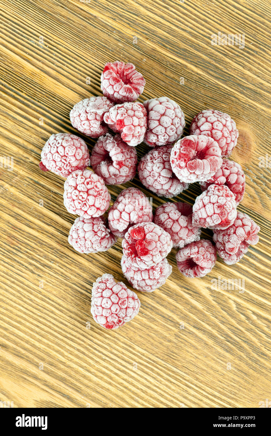 frozen raspberries during defrosting, photo closeup with frosted ...