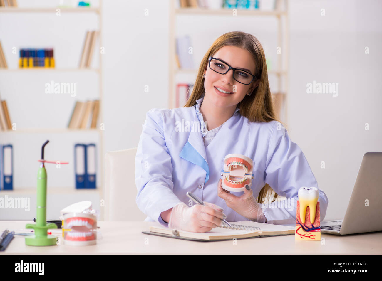 Dentistry student practicing skills in classroom Stock Photo - Alamy