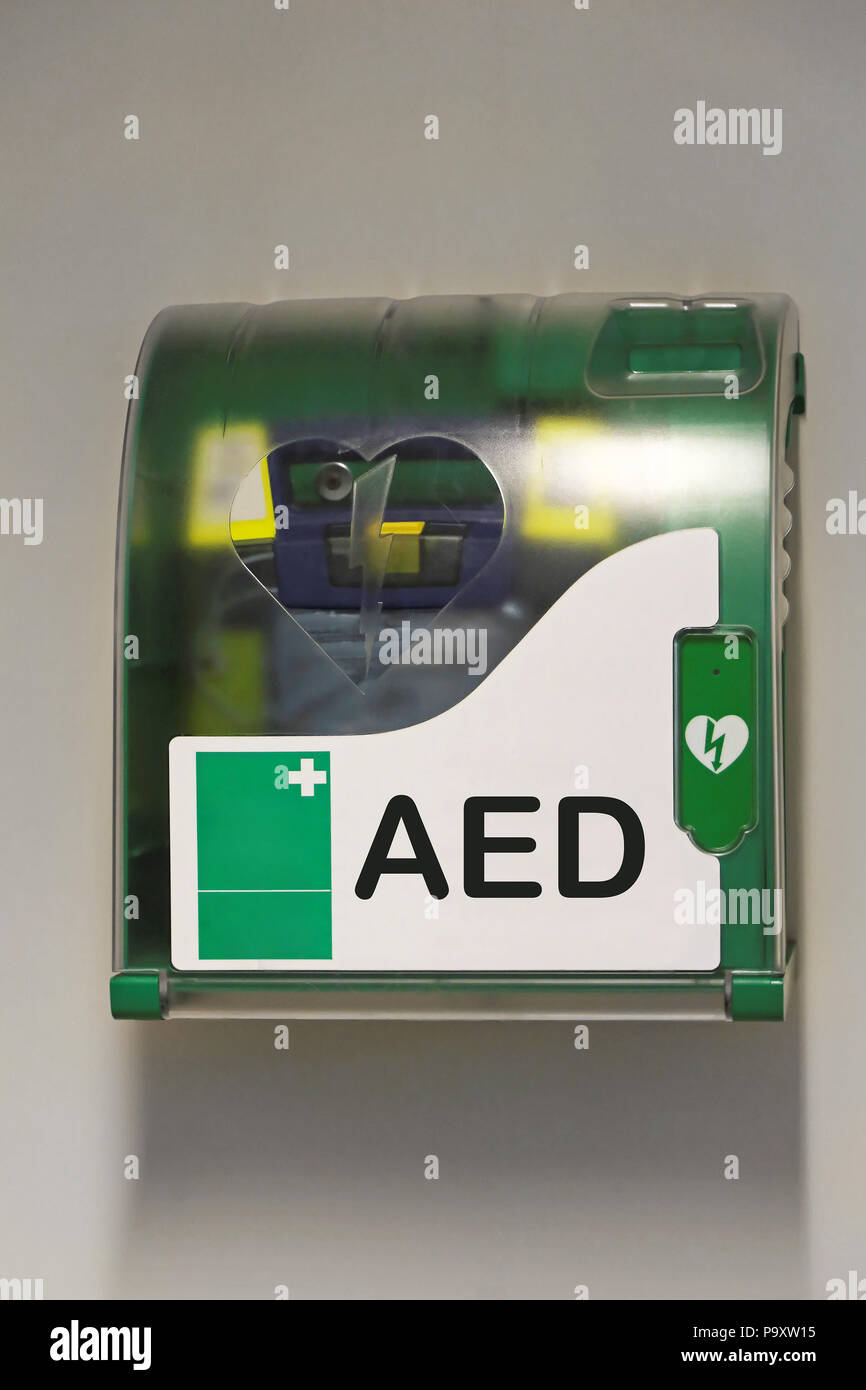 Automated external defibrillator emergency device at wall Stock Photo ...