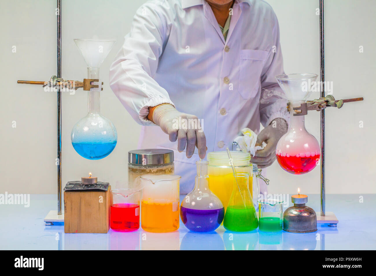 a scientist testing in laboratory experiments in chemical blending ...